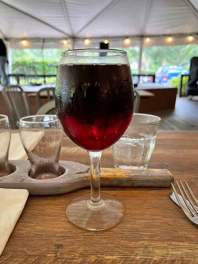 Deep ruby tones catch the light beautifully, hinting at the berry flavors waiting inside your glass.