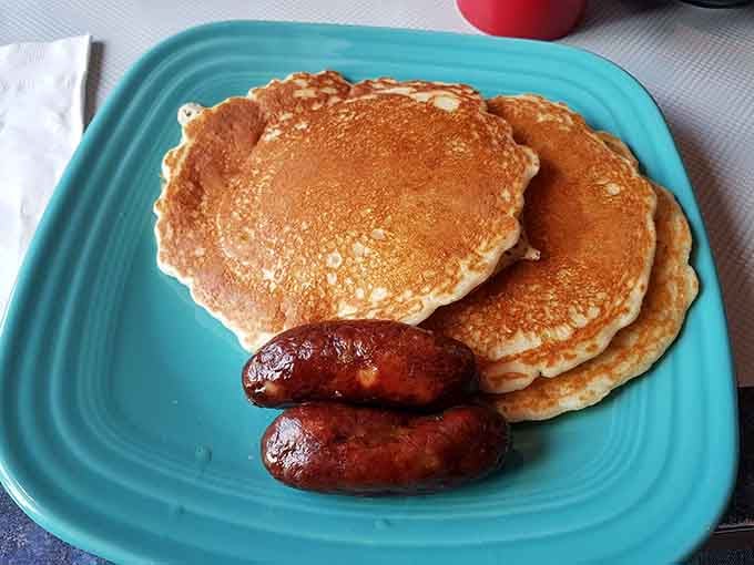 Golden pancakes and perfectly browned sausages prove that simple done right beats complicated done wrong every time.