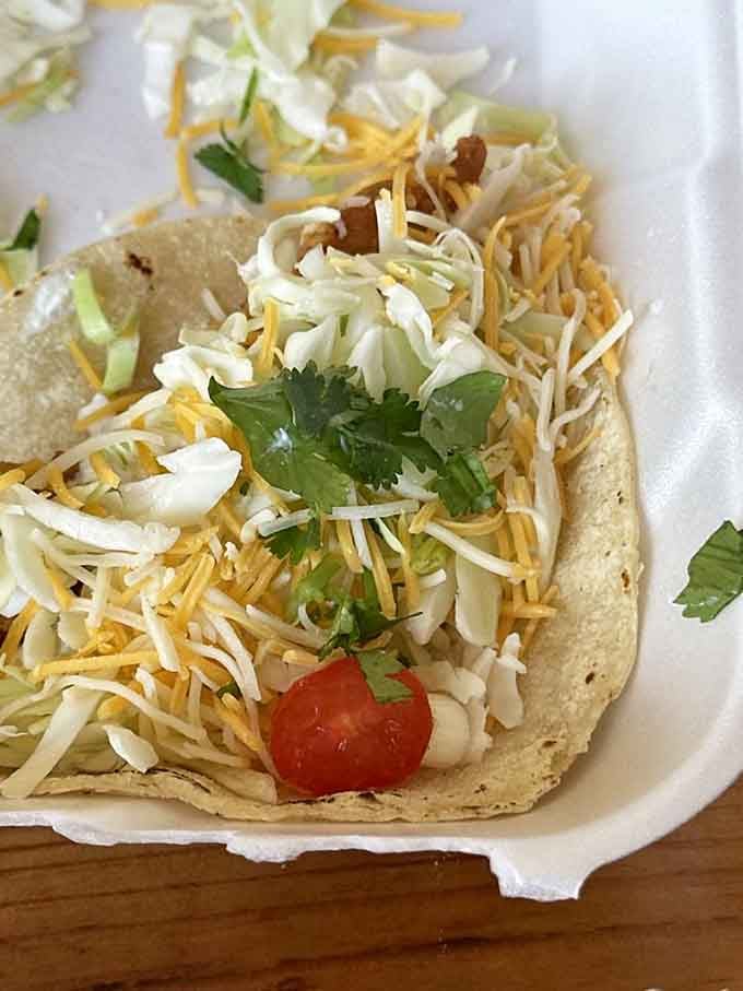 Fish tacos loaded with cheese and fresh toppings that'll make you forget you're nowhere near the ocean.