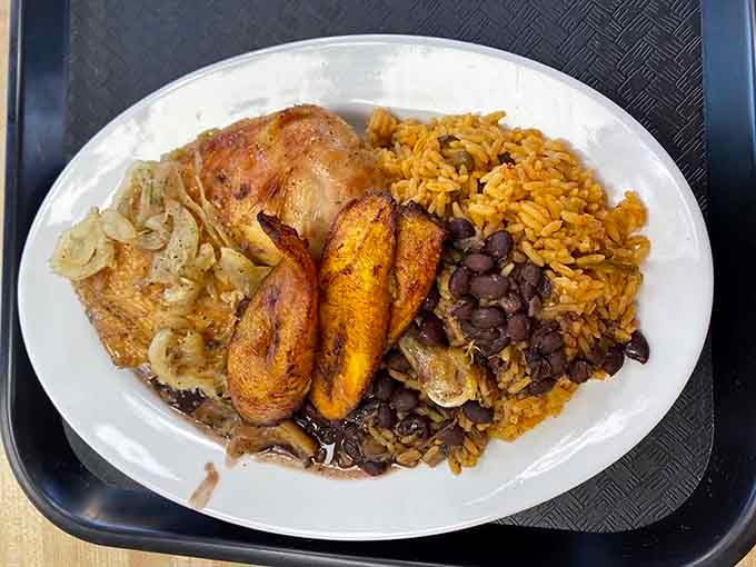 Golden roasted chicken with sweet plantains and black beans: comfort food that actually earns the title.