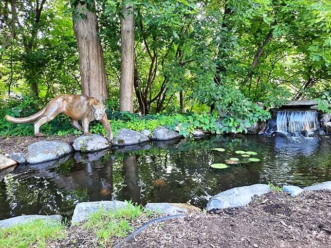 A tranquil pond where bronze sculptures meet lily pads, creating the kind of scene Bob Ross would approve.