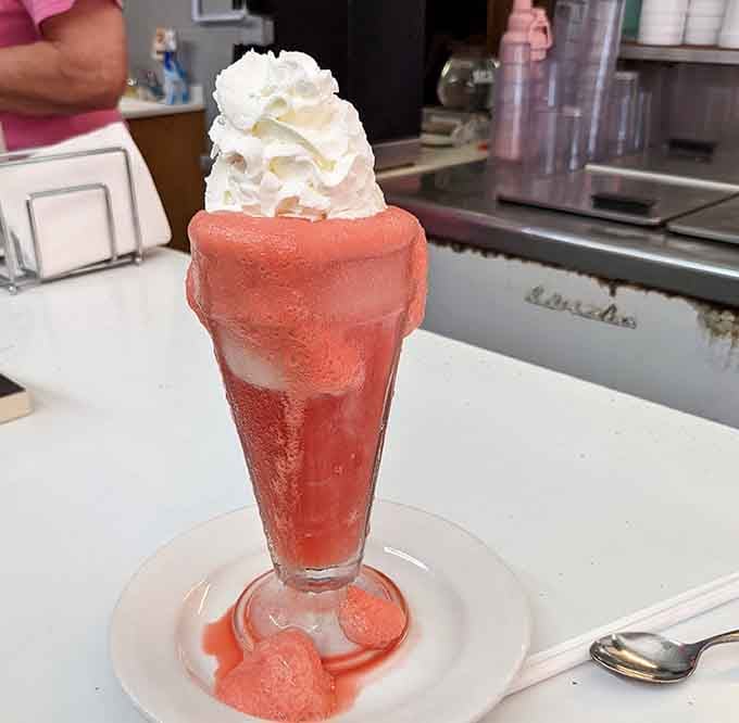 That strawberry soda float glows like a sunset you can actually drink, complete with whipped cream clouds on top.
