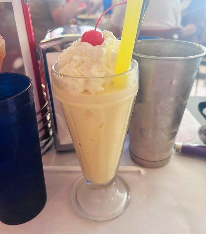A classic black cow shake served old-school style, proving simplicity done right never goes out of fashion.