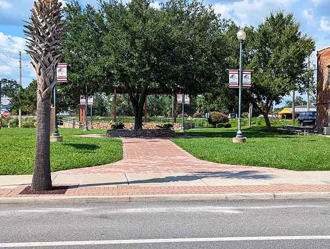 Brick pathways and shaded benches invite you to actually sit and relax without checking your phone constantly.