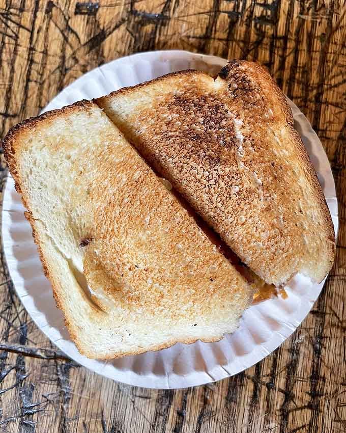 That golden toast holds America's original burger, proving simple beats fancy every single time without question.