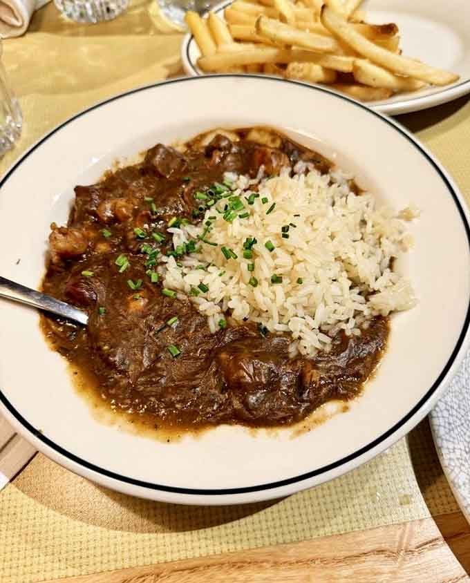 Rich, dark gumbo over rice that'll make you close your eyes and savor every single spoonful.