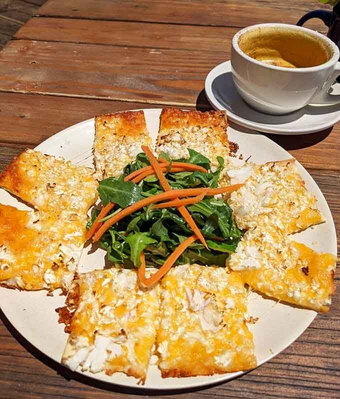 Cauliflower crust pizza topped with melted cheese proves virtuous eating can taste absolutely sinful and wonderful.