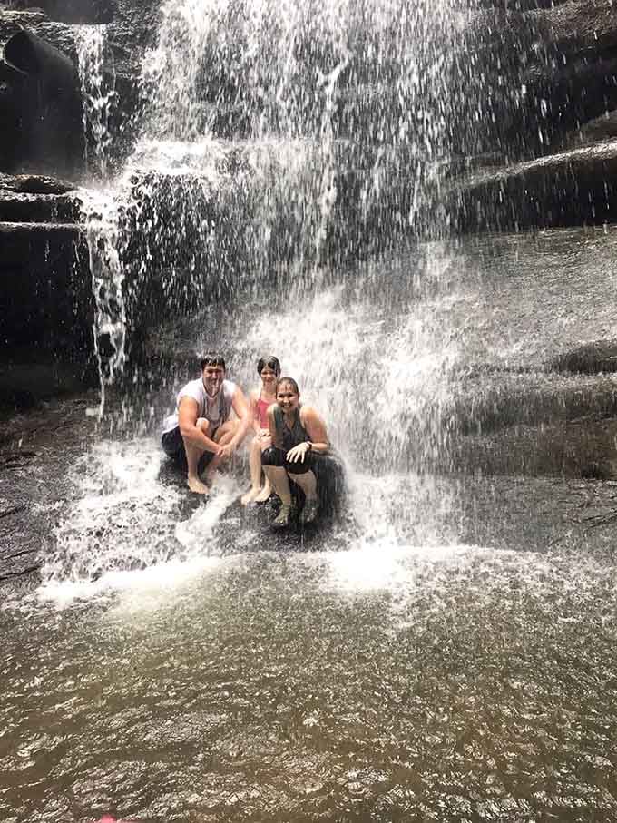 Nothing says family bonding quite like getting soaked together under a cascading waterfall on a warm afternoon.