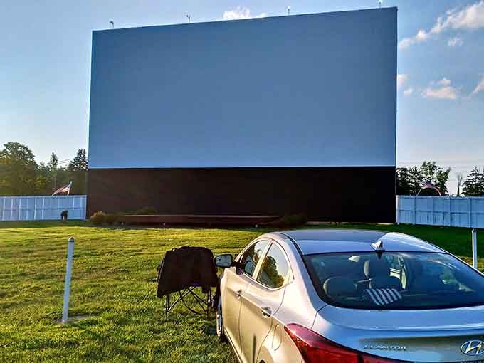 That pristine white screen against blue skies holds infinite possibilities for tonight's double feature adventure.