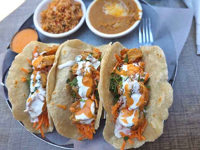 Bang Bang Shrimp Tacos arrive dressed to impress, loaded with toppings that'll make your taste buds dance.