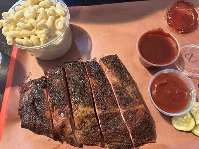 Behold the smoke ring of dreams—these ribs showcase the kind of patient cooking that can't be rushed or faked.
