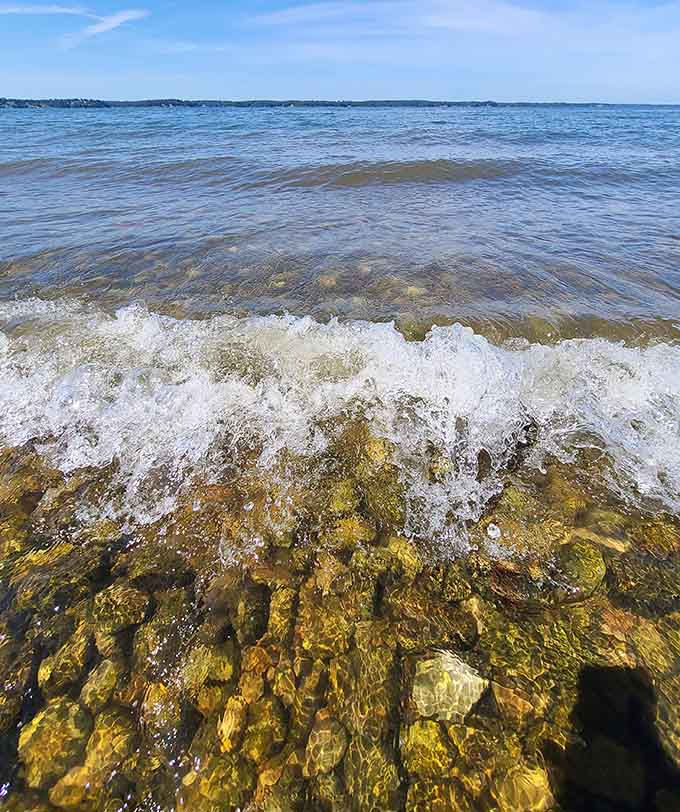 Clear water lapping over sun-drenched rocks proves Kentucky beaches can absolutely compete with coastal destinations anywhere.