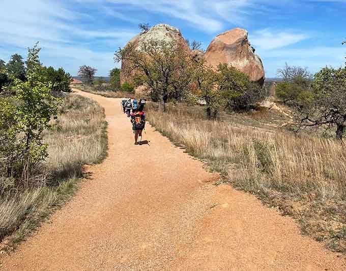 Following the trail toward that magnificent rock formation—it's like nature's own cathedral, minus the uncomfortable pews and collection plate.