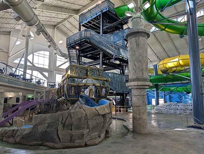 Indoor water slides twist and turn through Greek-inspired architecture, defying winter's best efforts to stop the fun.
