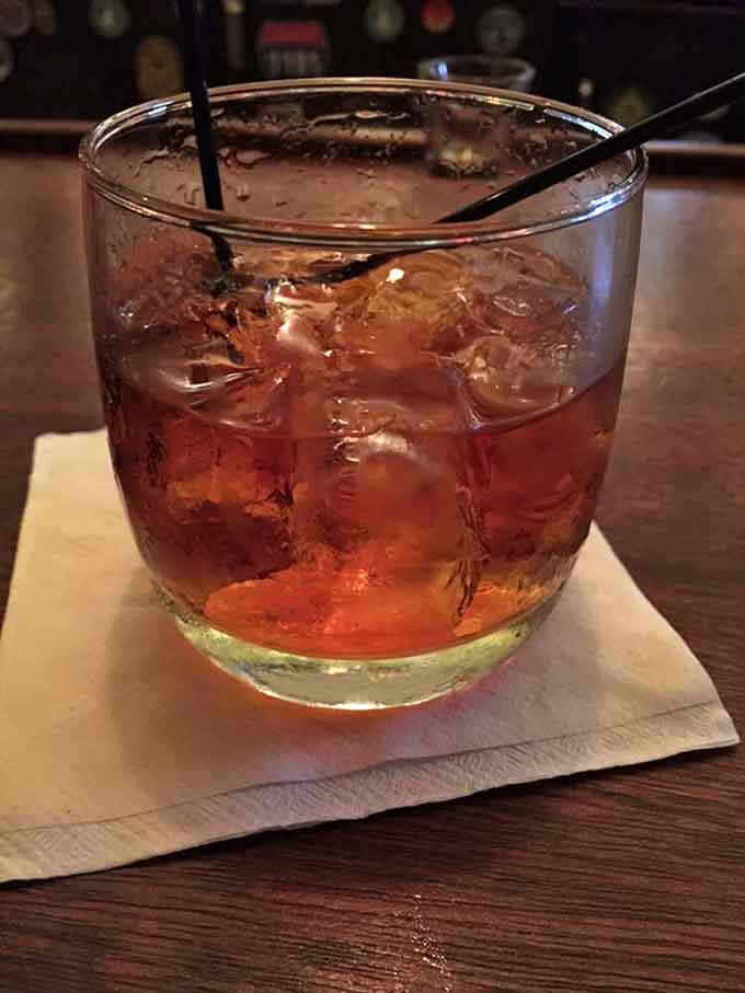 This amber beauty catches the light like liquid gold, waiting to warm you from the inside out, century-old style.