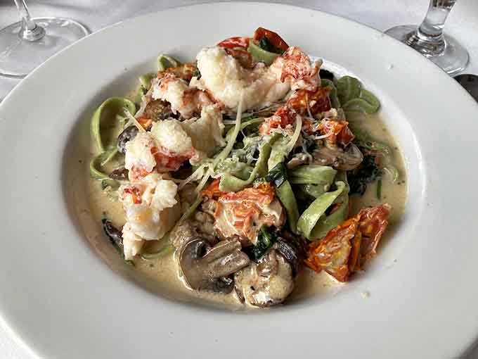 Lobster fettuccine with those vibrant green noodles delivers the kind of indulgence that makes calories completely irrelevant for tonight.