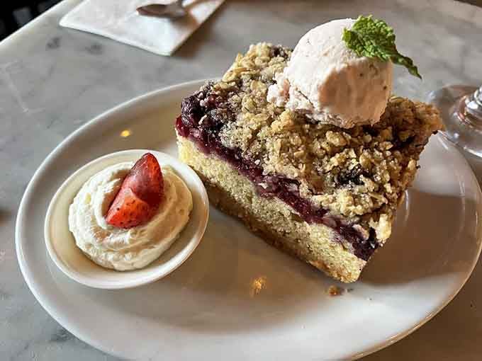 Berry crumble topped with ice cream and whipped cream, because grandmas don't believe in portion control or regrets.