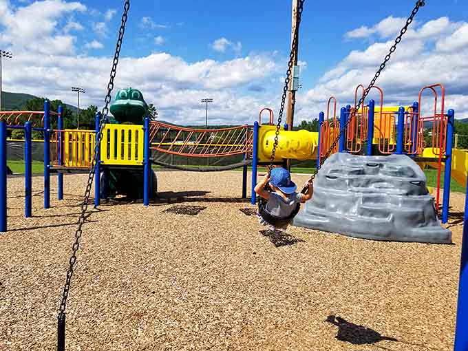 Grandkids approved: modern playground equipment where Social Security funded fun meets three generations of family memories in making.