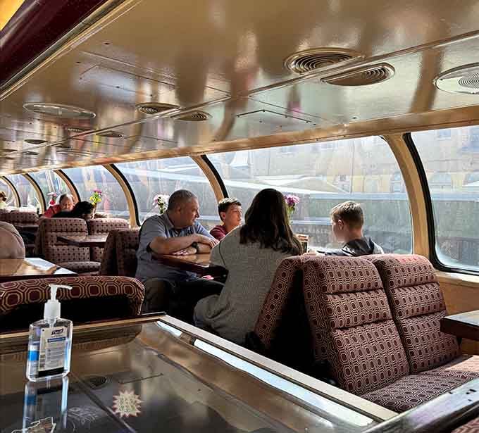 The dome car's curved windows turn every passenger into a wide-eyed kid watching the world roll by.