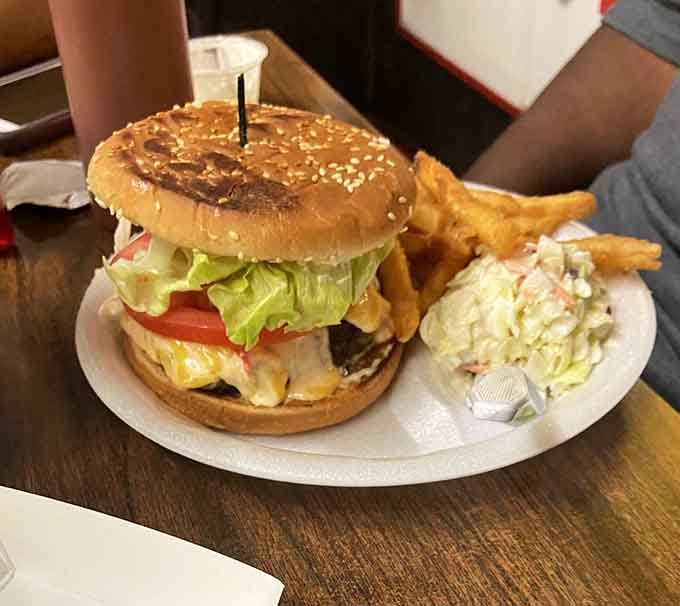 That pimento cheese burger sits on a sesame seed bun like a Southern crown jewel, fries standing guard.