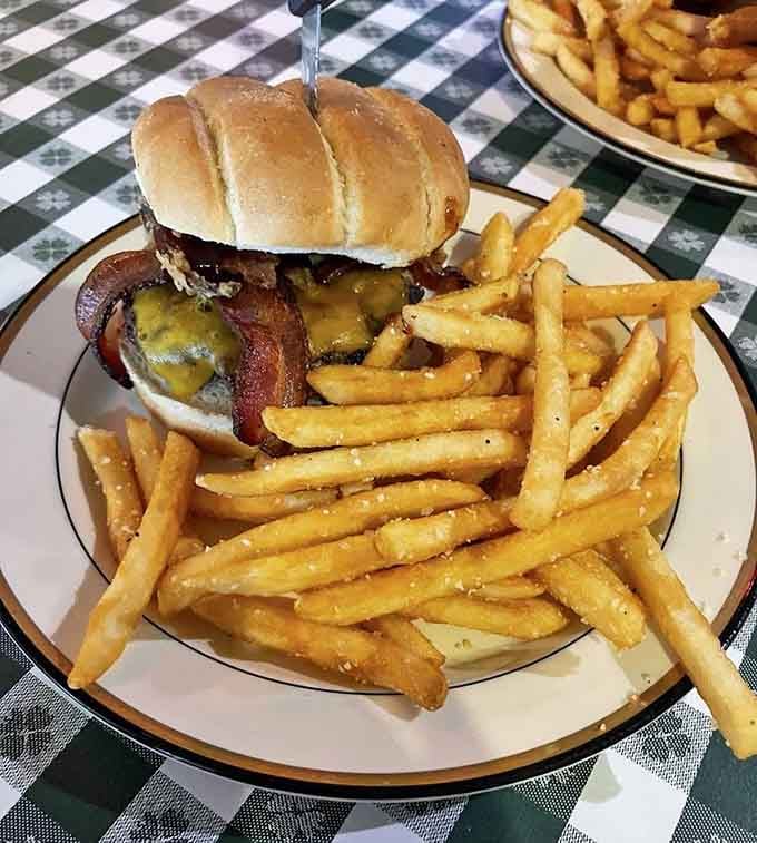When a burger comes stacked this high with bacon and cheese, you know someone in that kitchen truly understands joy.