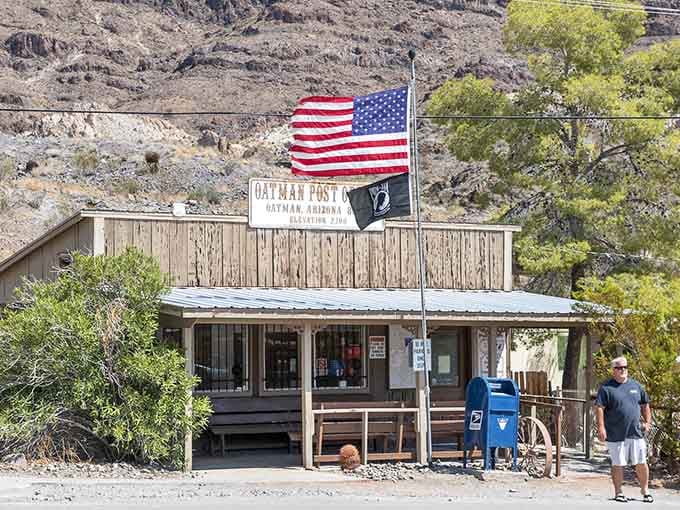 The Oatman Post Office waves its flags with patriotic pride, proving that even time-capsule towns need their mail delivered regularly.