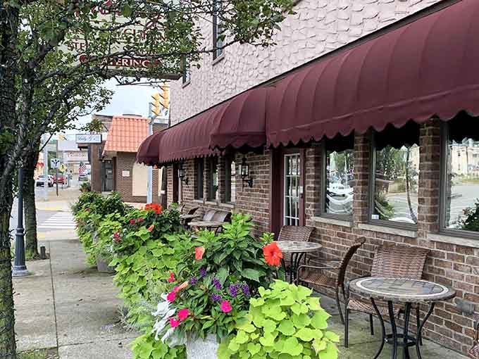 The classic brick facade and burgundy awnings signal you've arrived somewhere that takes its pizza heritage very, very seriously.