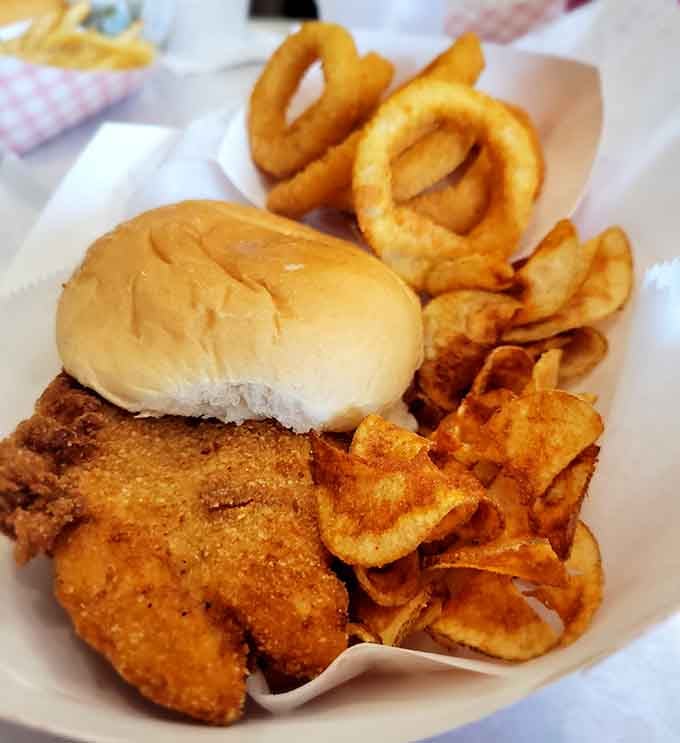 This platter doesn't mess around, featuring a fish filet with serious real estate ambitions and all the fixings.