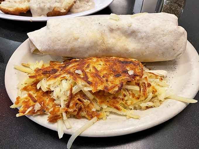 That breakfast burrito could double as a sleeping bag, paired with hash browns that achieved the perfect crispy-golden ratio.