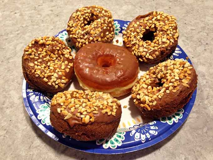 Peanut-topped beauties surrounding a glazed classic, like a delicious support group for your sweet tooth.