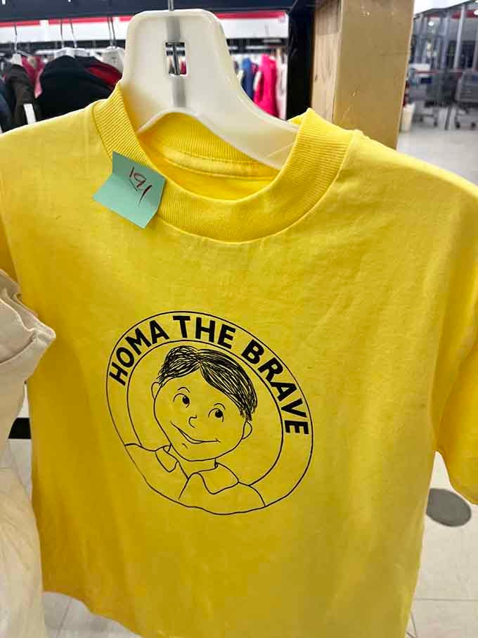 A "Homa the Brave" shirt in cheerful yellow, because sometimes the best finds are the ones that make absolutely no sense.