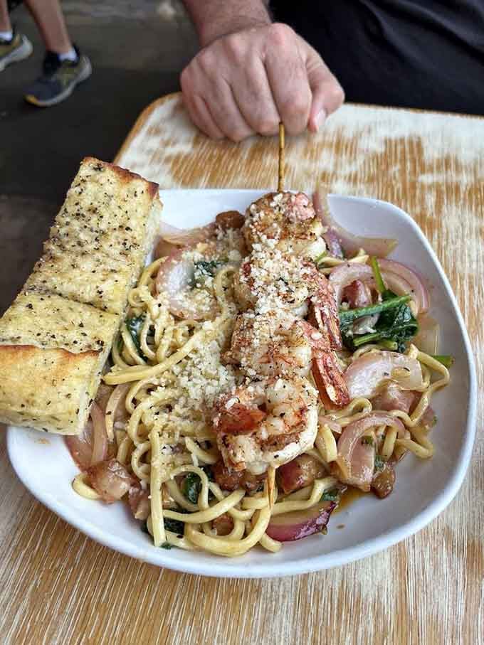 Plump shrimp nestle into perfectly cooked pasta, proving that garlic butter makes everything better in life.