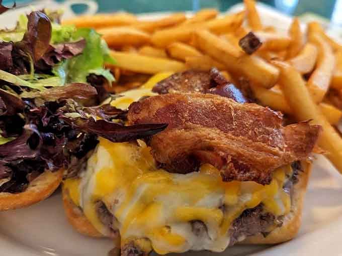 That bacon-topped burger with melted cheese and crispy fries is basically a love letter to your taste buds.