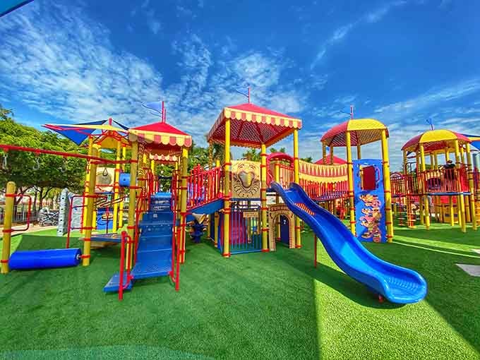 Multiple circus-themed towers create a playground village where imagination runs wilder than kids after too much birthday cake.