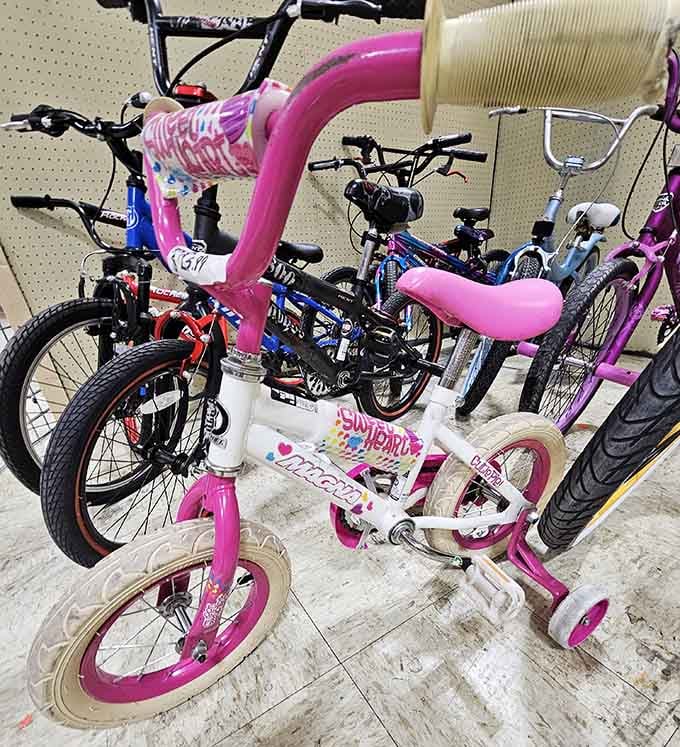 Kids' bikes waiting for their next adventure, training wheels and all, ready to create new memories.