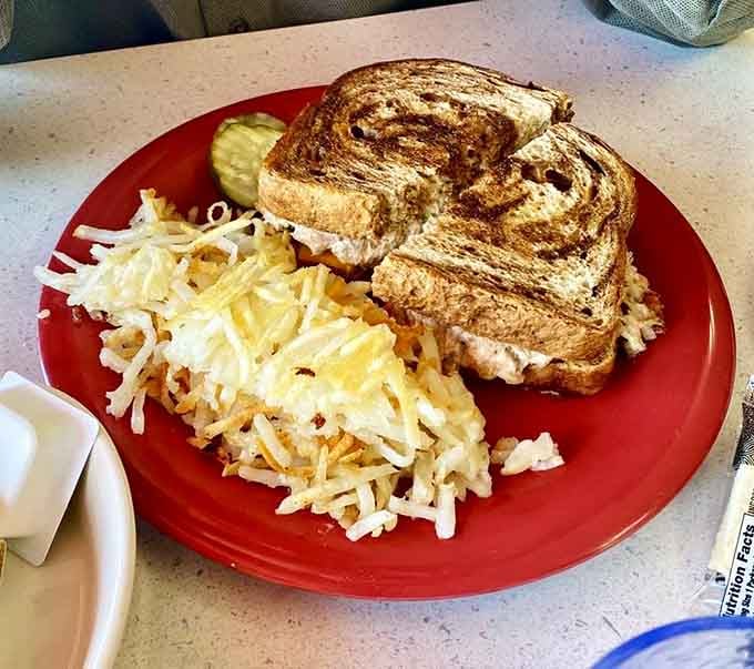 That golden-grilled sandwich with crispy hash browns proves lunch here deserves as much attention as breakfast does.