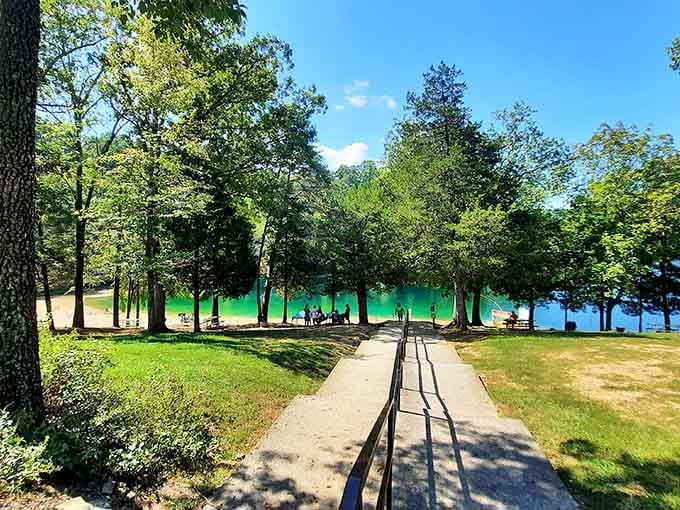 A shaded pathway leading to that stunning turquoise lake feels like walking into a vacation postcard.