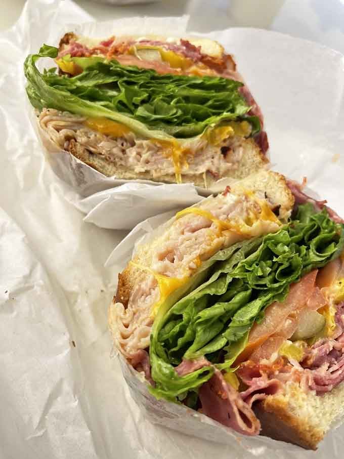 Layers of deli meat, cheese, and veggies stacked with the precision of a master architect.