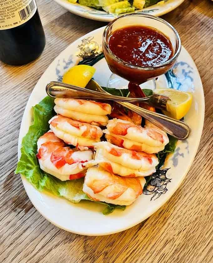 Jumbo shrimp cocktail arrives with that legendary steak sauce, proving seafood can hold its own here.