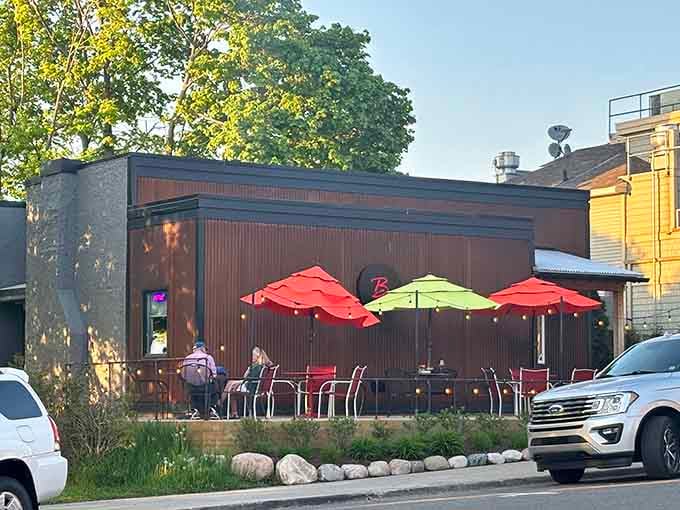 Outdoor dining with colorful umbrellas is the universal signal that good times and even better food are happening right here, right now.