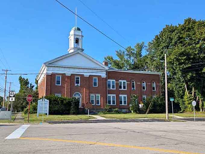 The cupola on this brick beauty suggests town meetings where actual decisions got made, not just endless committee discussions.