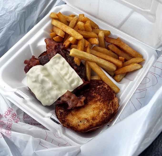 A cheeseburger and fries combo that proves lunch at a breakfast place is never a mistake.
