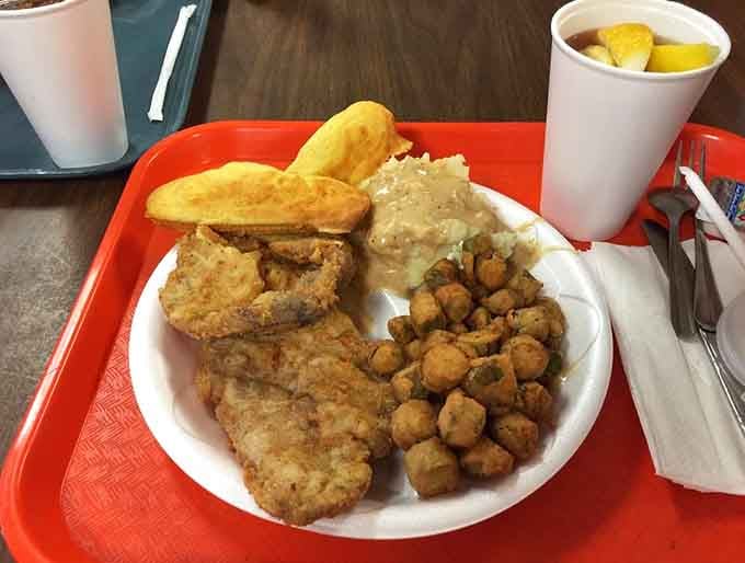 Boneless fried pork with okra and all the fixings proves lunch here rivals any Sunday supper you remember.