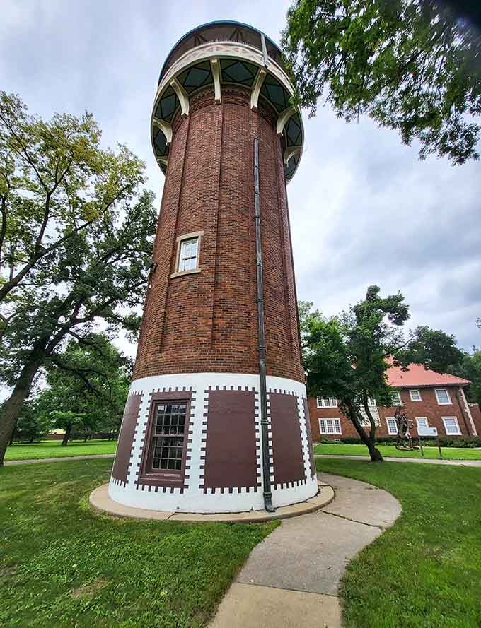 This distinctive water tower rises like a brick sentinel, watching over the town with quirky architectural charm and purpose.