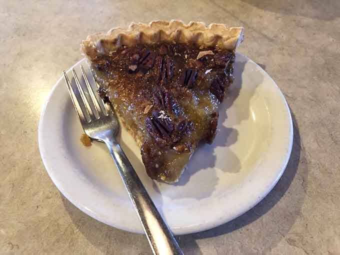 Look at that gorgeous pecan pie with its glistening filling and flaky crust, pure Southern perfection in every bite.