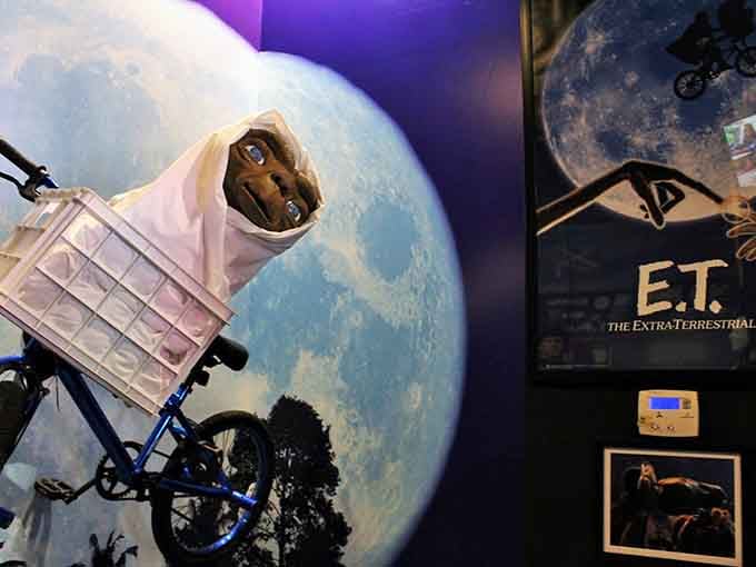 E.T. phones home from his bicycle basket, making you remember when Spielberg owned your entire childhood imagination.