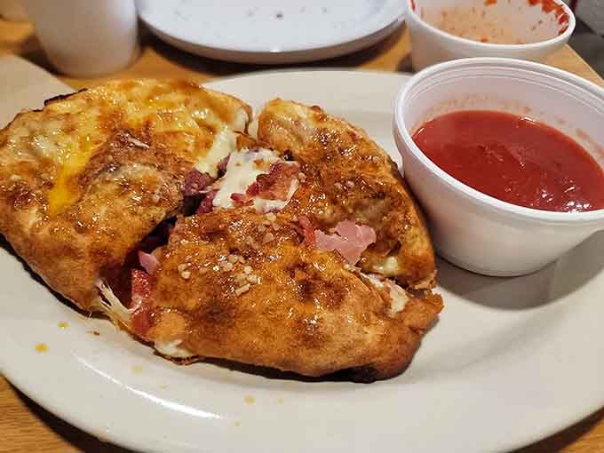 Golden calzone pockets that prove good things really do come to those who wait patiently.