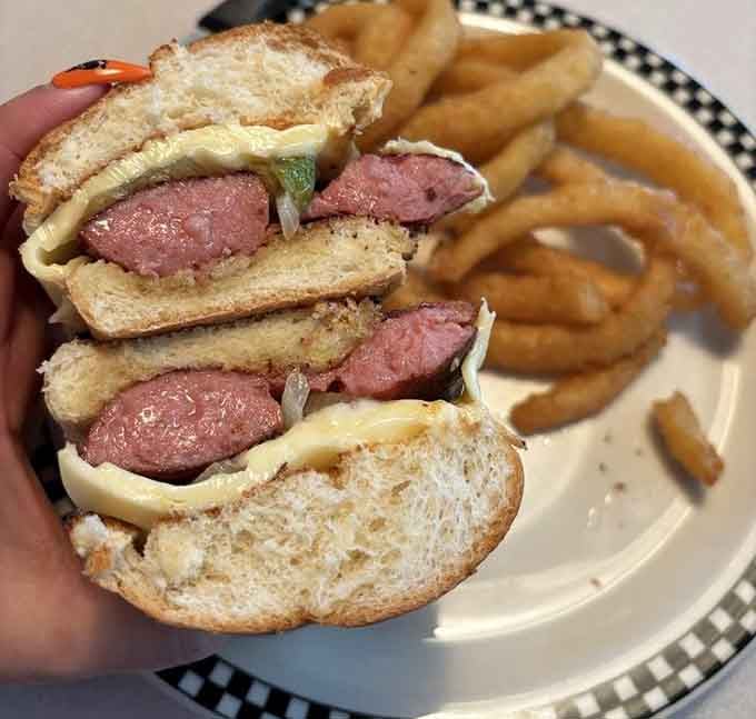 This smoked sausage sandwich comes with onion rings that could make a grown person weep with joy.