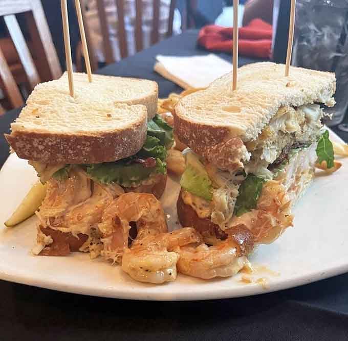 That sandwich is stacked so high it needs its own zip code and architectural support.