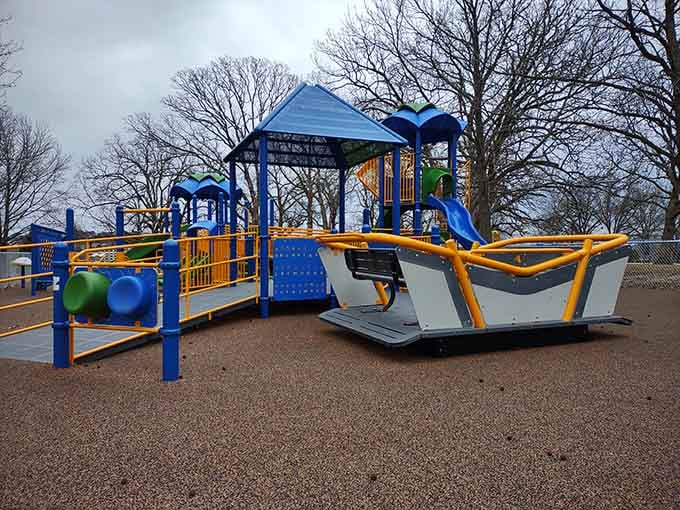 Modern playground equipment meets natural beauty where families create memories under Missouri's generous blue skies.